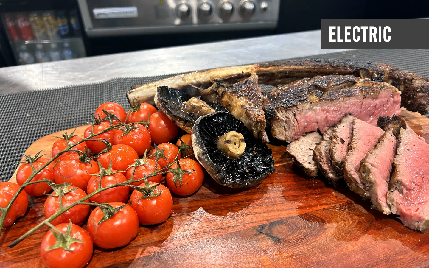 American Tomahawk Steak with roasted mushrooms and tomatoes - CROSSRAY